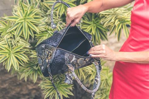 Premium Photo The Girl Is Holding A Bag Made Of Handmade Exotic