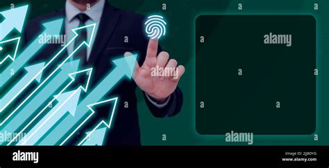 businessman pointing on fingerprint symbol in a futuristic design with