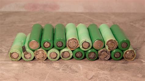 Close Up Of A Stack Of Green Lithium Ion Batteries Arranged On A