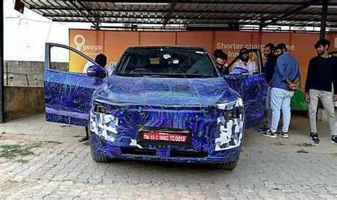 Upcoming 202mahindra Xuve9 Electric Coupe Suv Spotted At A Charging