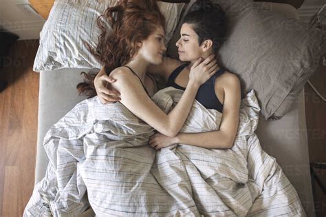 High Angle View Of Romantic Lesbian Couple Looking At Each Other While
