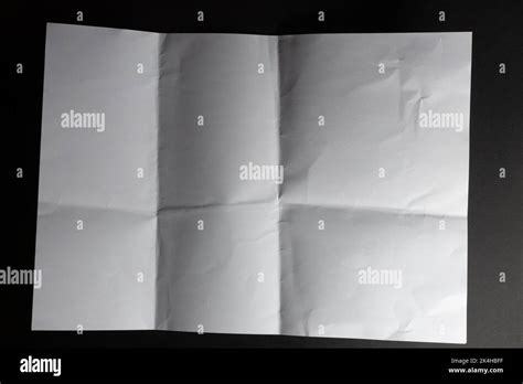 Light And Shadow On Creases In Sheet Of White Paper Folded Into Six