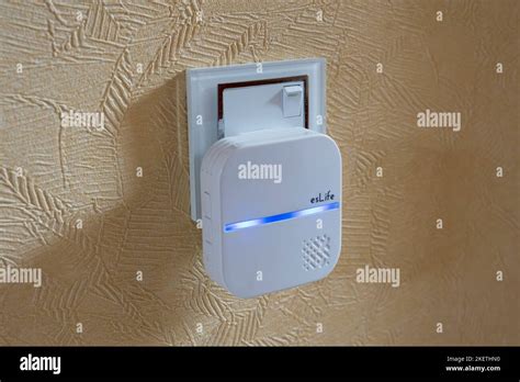 A Eslife Wifi Etxender Plugged Into A Socket And Used To Boost The Wifi Internet Signal In A