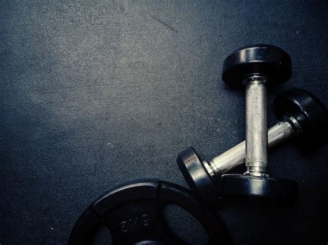Premium Photo Gym Equipment On Dark Floor Background