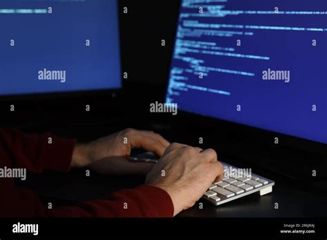 Hacker Working With Computers In Dark Room Closeup Cyber Attack Stock