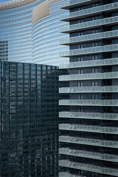 A Very Tall Building Next To A Very Tall Building Photo Building Image On Unsplash