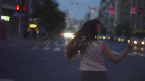 A Woman Crosses A Pedestrian Crossing In A Night City Stock Video