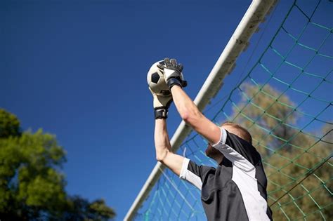 Premium Photo Sport And People Soccer Player Or Goalkeeper Catching