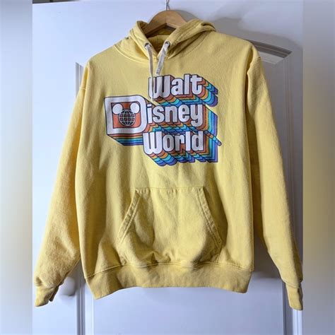 Disney Sweaters Disney Yellow Hoodie With Logo Poshmark