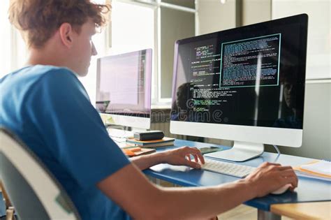 Boy Sitting At Desk With Computer Typing Code It Class In School Stock Image Image Of Lesson