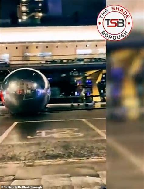 Bizarre Moment Two Giant Baubles Bounce Down Tottenham Court Road Daily Mail Online