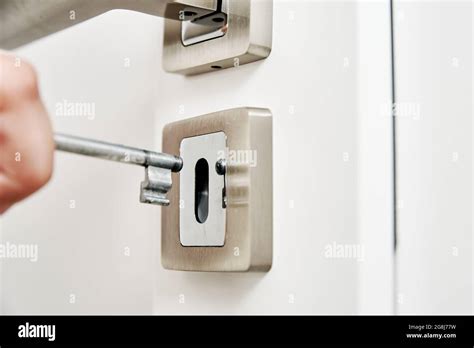 Woman Open Door Lock With A Key Close Up Of Door Key In Keyhole Stock Photo Alamy