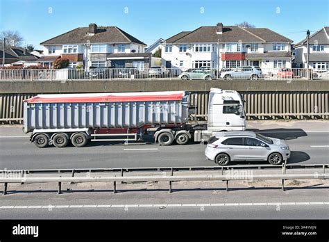 Hgv Lorry Truck Articulated Trailer And Car Driving On A12 Trunk Road