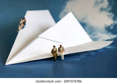 Couple Sit On Paper Plane Over Royalty Free Licensable Stock Photos Shutterstock