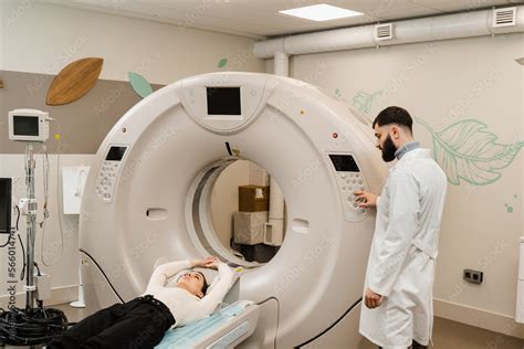 Girl Patient Is Doing CT Computed Tomography X Ray Scan Of Chest For Examination Of Abdomen In A