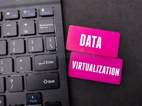 Black Keyboard And Colored Board With The Word Data Virtualization Business Concept Stock