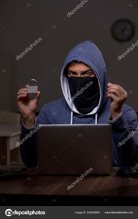 Male Hacker Hacking Security Firewall Late In Office Stock Photo By Elnur
