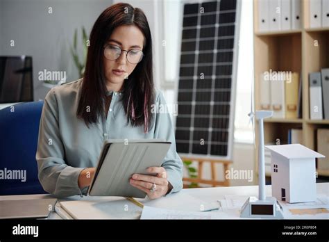 manager calculating off grid green energy project cost for customer