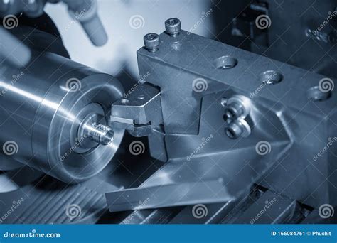 The CNC Lathe Machine In Metal Working Process Cutting The Parts With The Cutting Tools Stock