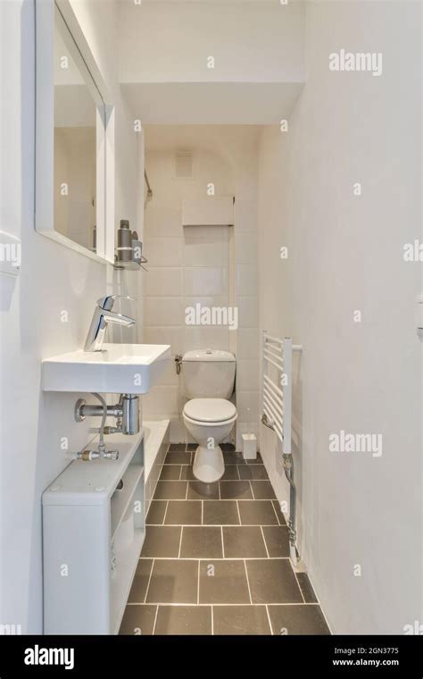 Interior Of Empty Small Light Bathroom With Clean Sink And Toilet In Apartment Stock Photo Alamy