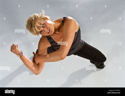 Blonde Cute Girl Dancing Shot Outdoor From Above With Flash On White
