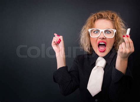 angry professor woman in front of blackboard is ready for wr colourbox