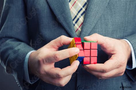 Businessman Holding Rubik Cube In His Hands Stock Photo Crushpixel