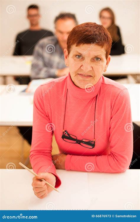Group Of People Of Different Age Sitting In Classroom And Attend Stock