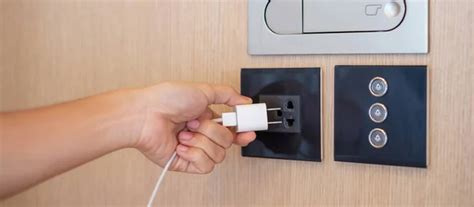Closeup Finger Unplugging Or Plugging Of Electricity Device At Home Energy Saving Power