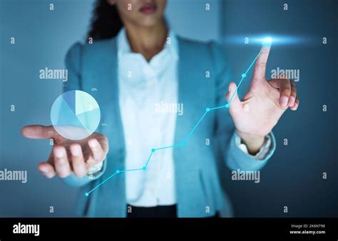 Planning Growth Based On Data An Unrecognisable Businesswoman Standing Alone In The Office And