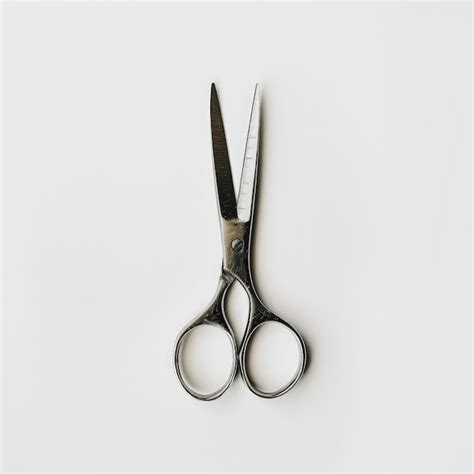 Premium Photo A Pair Of Scissors With A Gold Handle And A Brown Handle