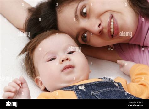 Mother And Baby Lying In The Bed Stock Photo Alamy