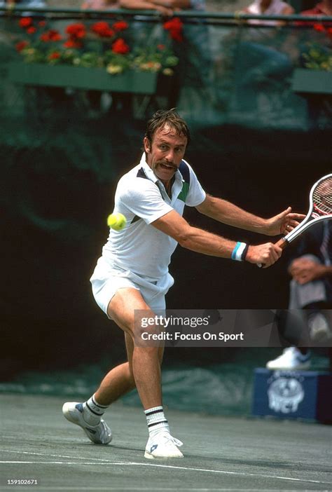 John Newcombe Of Australia Hit A Backhand Return During A Tennis