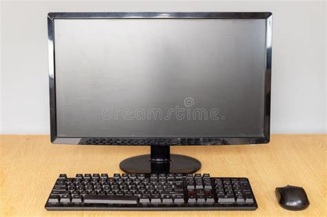 Front View Of A Modern Desktop Computer Setup With Monitor Keyboard