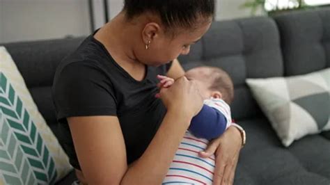 Mother And Son Sitting On Sofa Breastfee Stock Video Pond