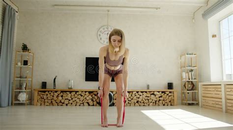 Exercises With Resistance Band Young Athletic Blonde Performs Bent