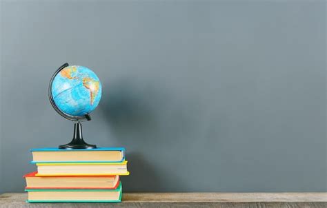 Premium Photo The Globe And Multicolored Books
