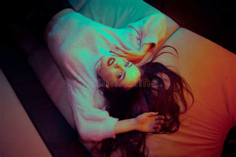 Sexy Beautiful Young Girl Lies On The Couch Seduces With A Look Stock