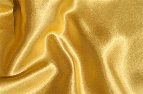 텍스처 직물 배경입니다 고급 스러운 직물 또는 액체 파도의 물결 그런 지 주름 실크 새틴 질감의 벨벳 소재 또는 고급 스러운 크리스마스 또는 우아한 배경 추상적인 배경 골드