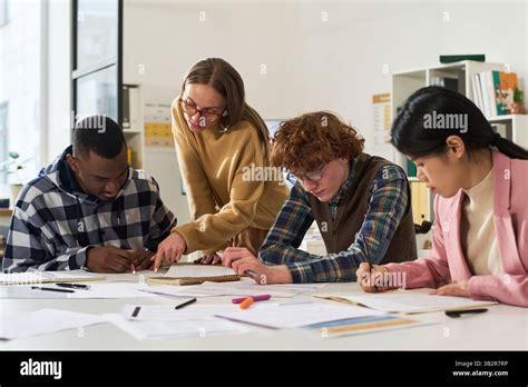 Group Of Diverse People Studying Foreign Languages In Classroom Stock