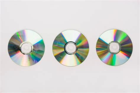 Premium Photo Three Circular Compact Disc On White Background