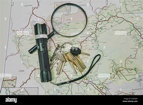 map flashlight magnifying glass keys trip planning to the central