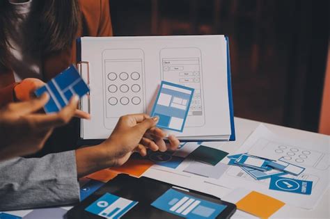 Premium Photo Team Of UI UX Web Designer Are Working Together To Develop Mobile Responsive