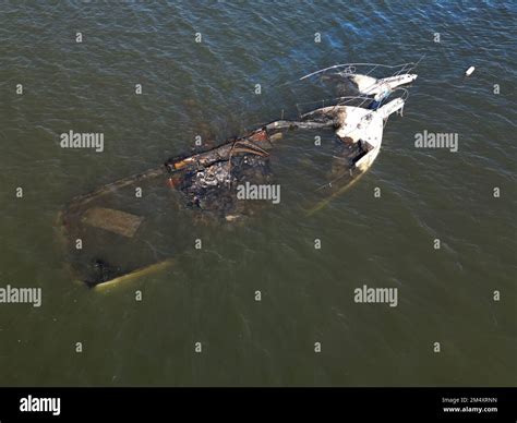 Aerial View Looking Straight Down From Above At Capsized Boats That