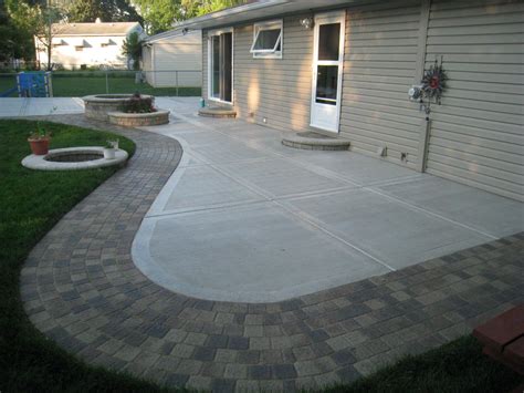 Concrete Surrounded By Pavers Patio Concrete Patio Designs Poured