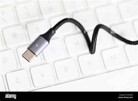 Usb Type C Cable Against Laptop Keyboard Background Stock Photo Alamy