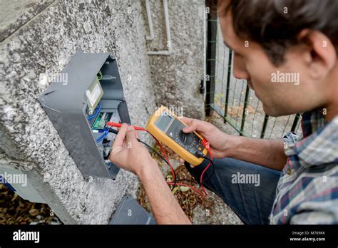 Electrician Testing Electric Box Stock Photo Alamy