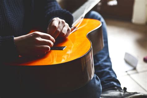 How To Change Guitar Strings On An Acoustic Guitar