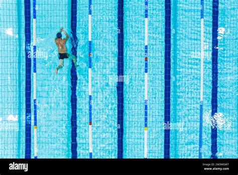 Active Leisure Time Concept Unrecognizable Man In Swimming Alone In A Swimming Pool High Angle