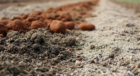 Close Up Of Rich Earth Clods And Fine Gravel Texture Stock Illustration